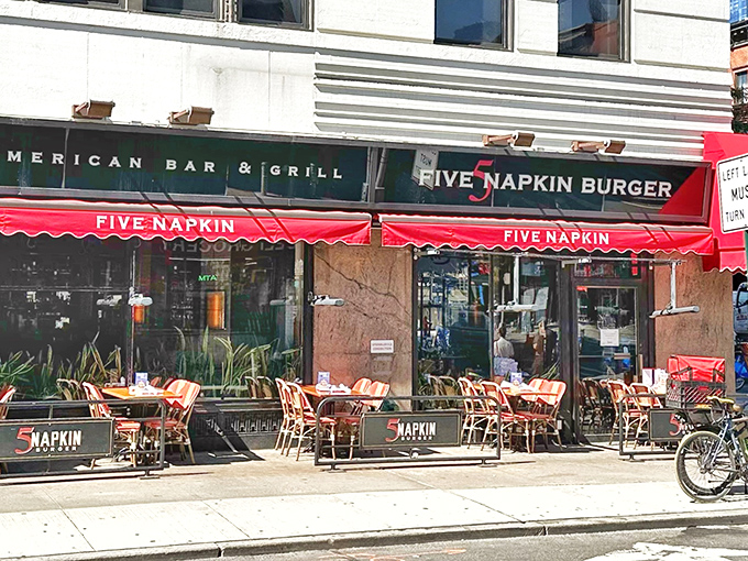 That iconic red awning is like a beacon for burger lovers navigating the urban jungle. Sidewalk seating beckons with prime people-watching possibilities.