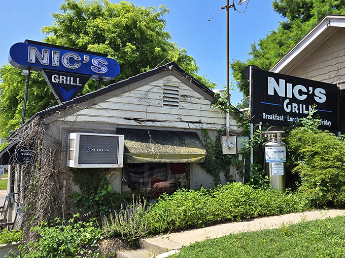 The humble exterior of Nic's Grill belies the culinary treasures within. This unassuming shack houses Oklahoma City's burger paradise.
