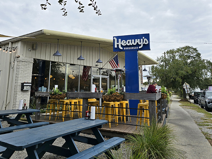 The blue sign beckons like a lighthouse for the hungry&mdash;Heavy's Barburger's unassuming exterior hides culinary treasures within.