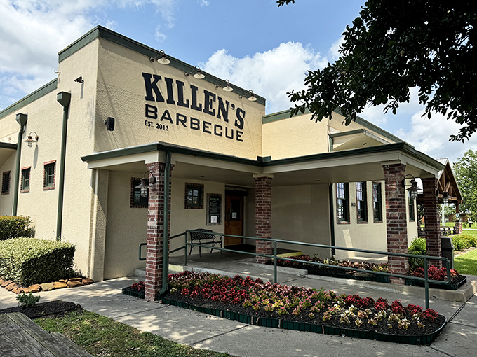 The unassuming exterior of Killen's BBQ stands like a temple to Texas smoking traditions, promising transcendent meat experiences within its humble walls. 
