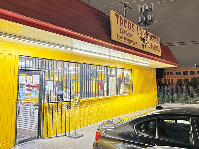 The bright red exterior of Tacos La Banqueta stands out like a beacon of hope for hungry travelers. No fancy architecture needed when the food speaks this loudly.