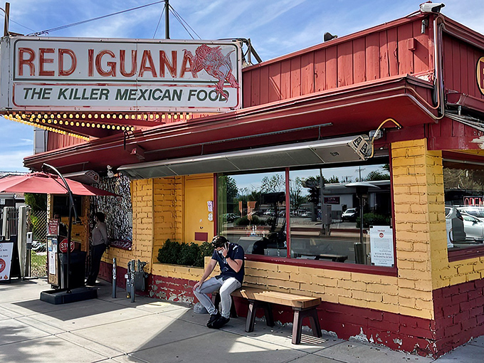 The neon glow of Red Iguana's iconic sign beckons hungry pilgrims like a lighthouse for those lost in a sea of mediocre Mexican food.