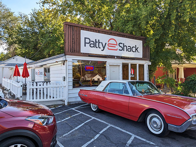 The classic white exterior with that vintage sign promises no-frills perfection. That red Thunderbird knows what's up. 