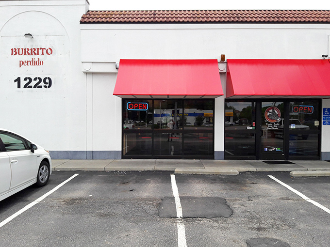 The unassuming storefront that launched a thousand road trips. Like finding a diamond in a strip mall, Burrito Perdido's exterior promises culinary treasures within.