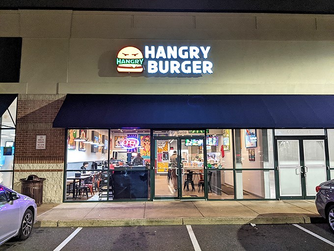 The beacon of burger bliss! Hangry Burger's illuminated storefront promises salvation for those teetering on the edge of hunger-induced crankiness.
