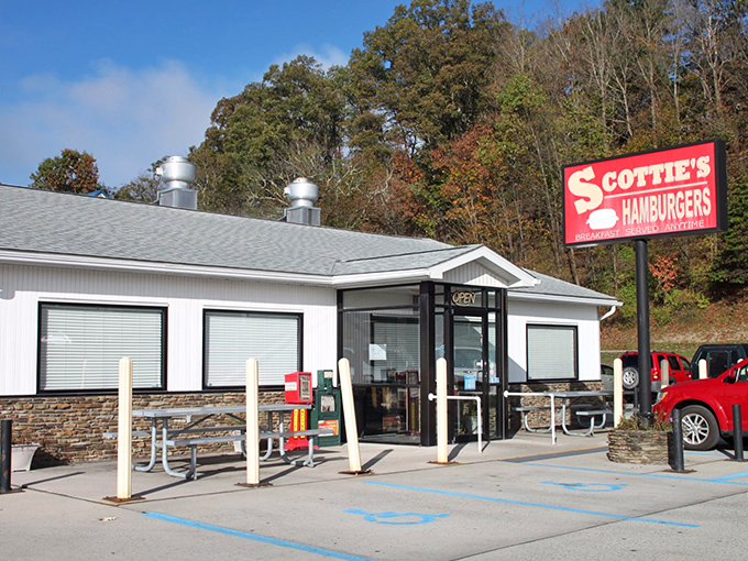 Simplicity speaks volumes at Scottie's exterior, where that iconic red sign promises hamburger heaven against West Virginia's rolling hills.