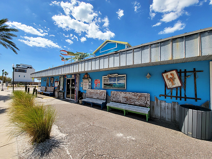 The iconic turquoise exterior of Crabby Bill's stands out against the Florida sky like a beacon for hungry beachgoers seeking seafood salvation.