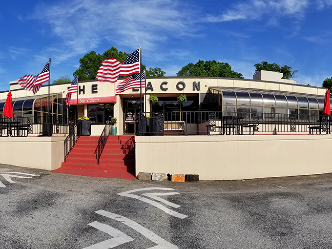The Beacon's iconic fa&ccedil;ade stands proudly in Spartanburg, its red awnings and stone steps beckoning hungry travelers like a culinary lighthouse on the South Carolina shore.