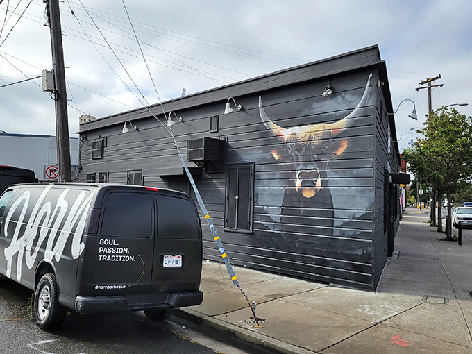 The unassuming exterior of Horn BBQ in Oakland &ndash; where that bold white lettering against dark panels is the architectural equivalent of a whisper about the best-kept secret in town.