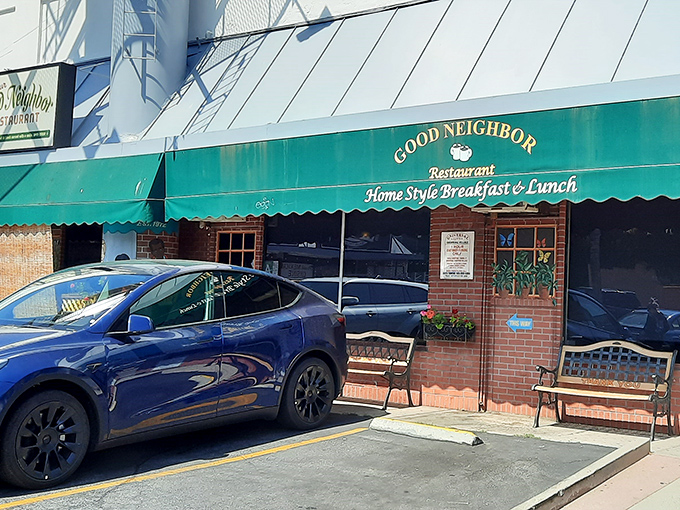 The unassuming green awning of Good Neighbor Restaurant beckons like an old friend, promising home-style comfort without the fanfare.