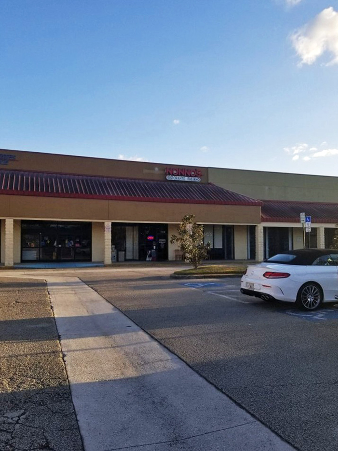 Nonno's welcomes hungry travelers with its cheerful red signage, like a beacon of Italian comfort food in a Florida strip mall. 