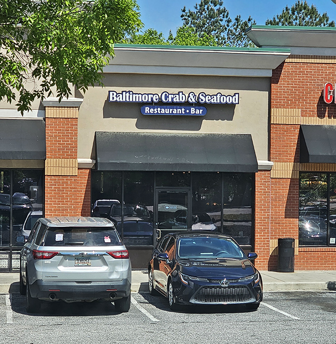 The blue neon sign beckons like a lighthouse for seafood lovers. Maryland magic awaits inside this Atlanta treasure.