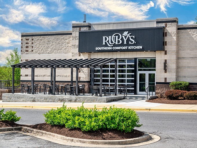 Ruby's glows like a beacon of Southern promise against the night sky, beckoning hungry travelers with its sleek exterior and warm lighting.