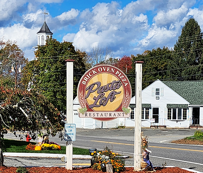 The unassuming exterior of Pasta Loft belies the culinary treasures within. That bicycle on the roof? It's how the staff burns off all those carbs.