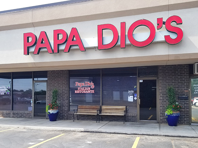 The glowing red sign beckons like a lighthouse for the pasta-starved. No fancy frills, just the promise of authentic Italian goodness waiting inside. 