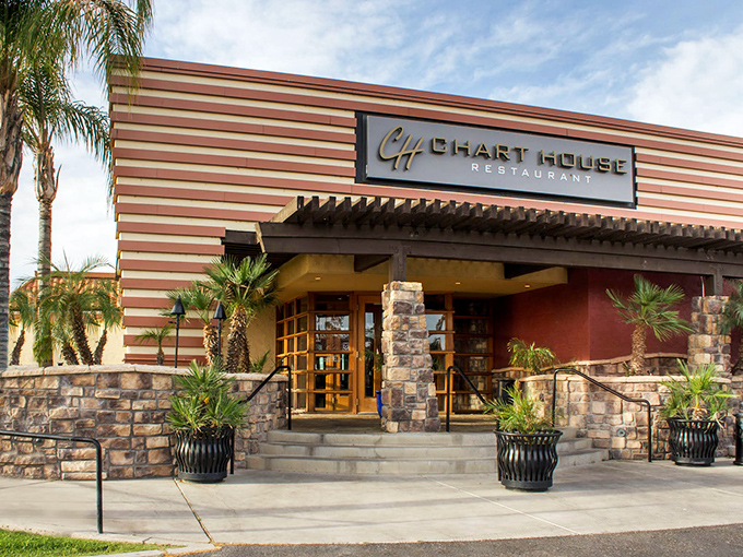 The Chart House exterior welcomes you with its distinctive horizontal stripes and stone accents&mdash;like a mid-century modern postcard that promises good times and better meals inside. 