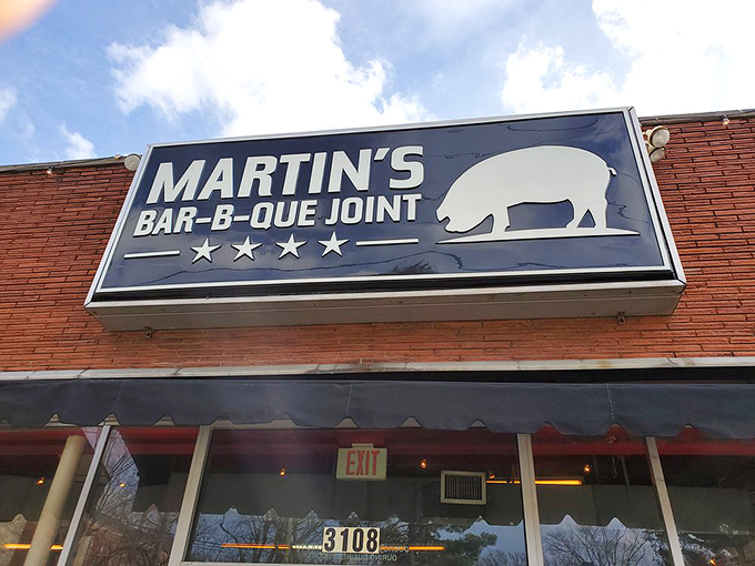 The red brick exterior of Martin's Bar-B-Que Joint beckons hungry pilgrims with its no-nonsense fa&ccedil;ade and the promise of smoky delights within.