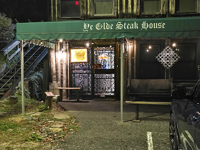 The rustic stone facade of Ye Olde Steak House stands like a carnivore's cathedral, promising meaty salvation to all who enter its hallowed doors.