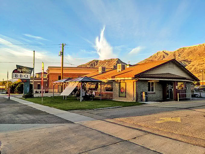 The promise of transcendent barbecue awaits in this unassuming brick building, where Utah's Wasatch Mountains provide the perfect dramatic backdrop for smoke-fueled culinary magic.