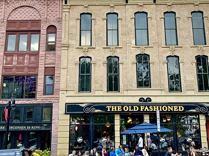 The Old Fashioned stands proudly on Madison's Capitol Square, its classic signage promising Wisconsin comfort in a building that looks like it's been telling stories for generations.