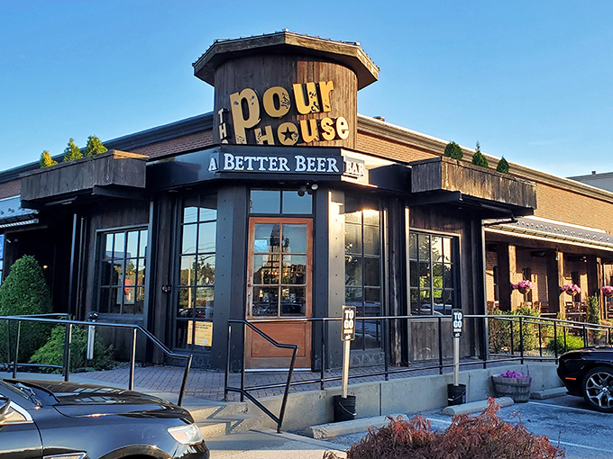 The Pour House's distinctive octagonal entrance and rustic wooden exterior isn't just inviting—it's practically shouting "Get in here and try our wings already!"