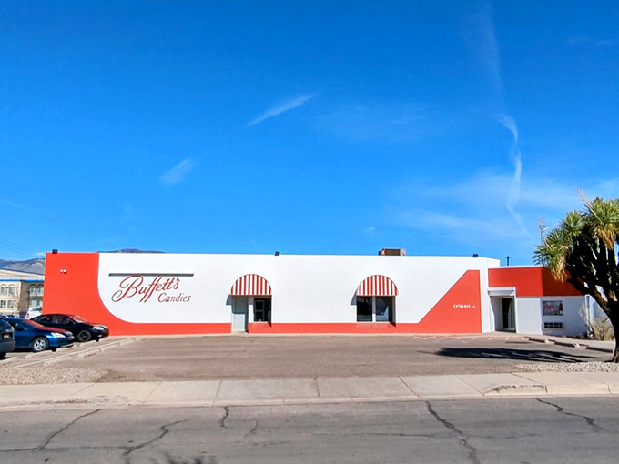 The red and white exterior of Buffett's Candies stands like a sweet mirage in the desert, promising sugary salvation to Albuquerque's candy pilgrims.