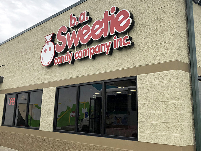 The cherry-topped sign beckons like a lighthouse for sugar enthusiasts. Sweeties Candy Company stands ready to fulfill childhood dreams in Cleveland.