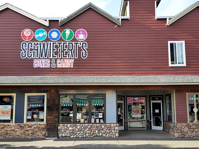 The burgundy facade of Schwietert's stands like a beacon of sweetness on Broadway Street, promising sugar-fueled adventures within those stone-trimmed walls.