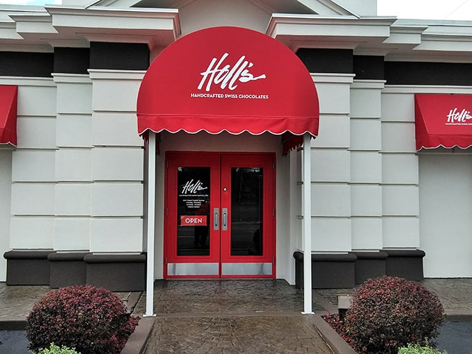 The iconic red awning of Holl's beckons chocolate lovers like a Swiss flag signaling delicious neutrality in the battle against willpower.
