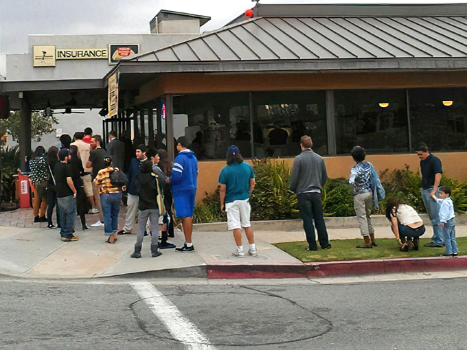 The line outside Tops doesn't lie! Devoted breakfast pilgrims make the weekend wait part of the experience, a testament to pancakes worth standing for.