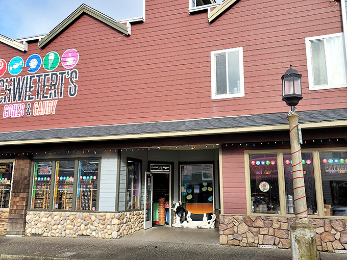 The burgundy facade of Schwietert's stands like a beacon of sweetness on Broadway Street, promising sugar-fueled adventures within those stone-trimmed walls.