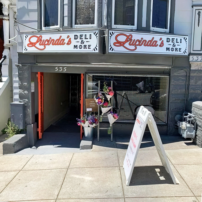 A sandwich sanctuary nestled in classic San Francisco architecture. Lucinda's storefront promises culinary treasures behind those bright orange doors.