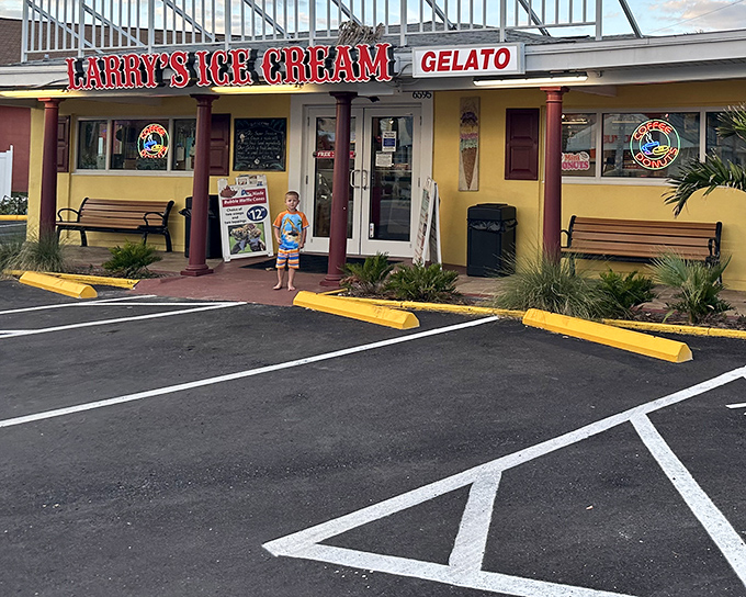 The cheerful yellow facade of Larry's beckons like a dessert lighthouse, promising sweet salvation from Florida's relentless heat.