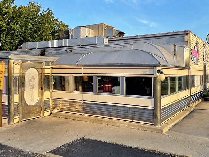 The gleaming stainless steel exterior of Nancy's Main Street Diner catches the morning light like a time machine waiting to transport you back to simpler times.