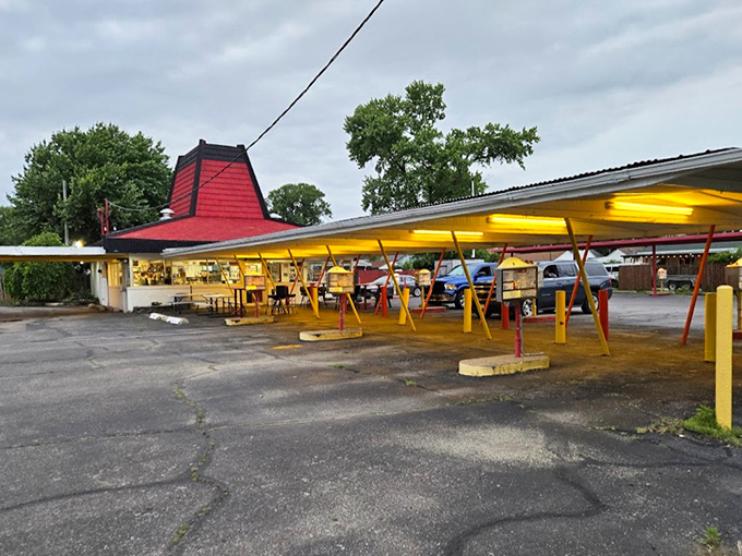 The iconic red roof and yellow poles of Cranwill's stand like a time capsule against the Illinois sky, beckoning hungry travelers to step back into simpler times.