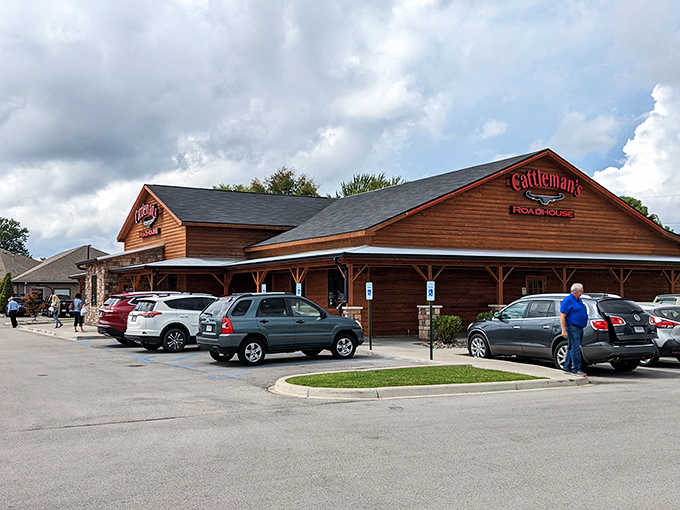 The rustic wood-and-stone exterior of Cattleman's Roadhouse stands like a beacon of hope for hungry travelers. Comfort food paradise awaits inside those doors.