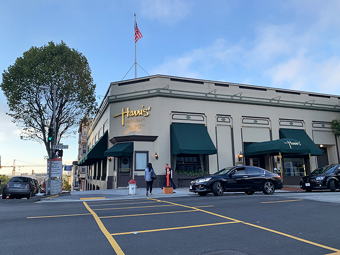 Harris' Restaurant stands like a distinguished gentleman on Van Ness Avenue, complete with patriotic flag and timeless charm.