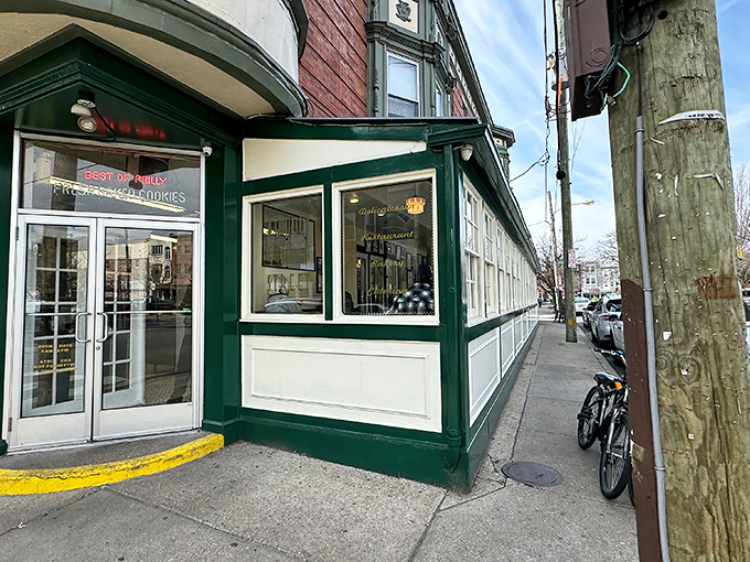 The iconic green and white exterior of Famous 4th Street Delicatessen stands as a beacon of sandwich excellence in Philadelphia's Queen Village neighborhood.