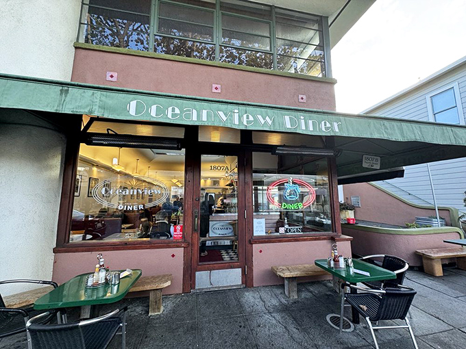 The mint-green awning of Oceanview Diner beckons like a time portal to simpler days when breakfast solved everything and calories didn't count.