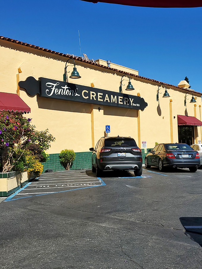 The sunshine-yellow exterior of Fentons Creamery stands like a beacon of sweet promises, its vintage sign a time portal to simpler days.