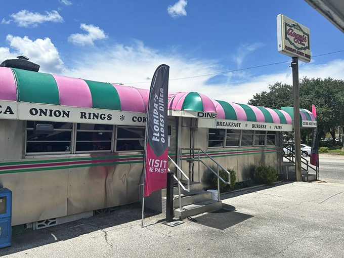 That iconic pink and green striped awning isn't just eye-catching&mdash;it's a time machine disguised as a diner, beckoning hungry travelers since long before Instagram made everything "retro."