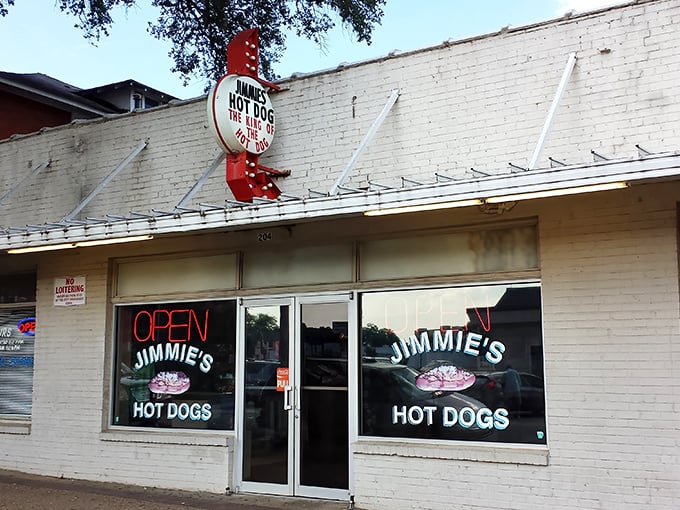 The unassuming exterior of Jimmie's Hot Dogs stands as a time capsule in Albany, complete with vintage signage and a strict "No Loitering" policy that locals respect religiously.