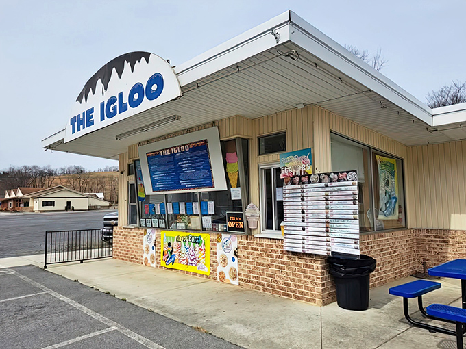 The Igloo stands like a frozen mirage in the Pennsylvania countryside, its distinctive white roof and blue lettering beckoning ice cream pilgrims from miles around.