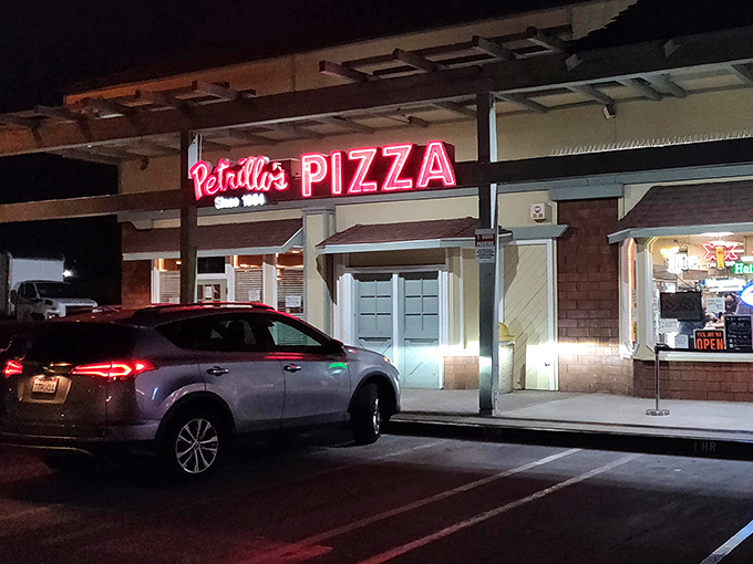 The iconic red sign beckons like a lighthouse for the pizza-obsessed. Since 1954, this Glendora institution has been proving that sometimes the best things don't change.