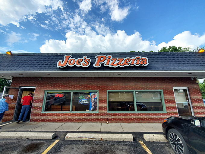 The brick facade of Joe's Pizzeria stands like a time capsule under Ohio skies, promising pizza perfection that's remained unchanged while the world around it spins madly on. 