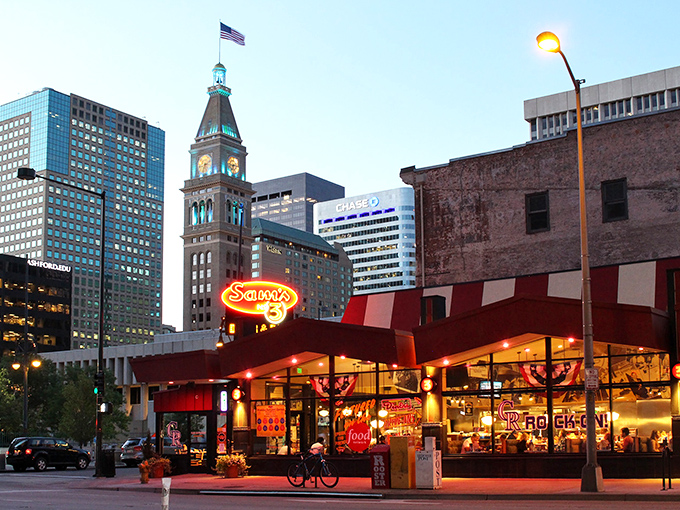 The neon glow of Sam's No. 3 against Denver's skyline isn't just a sign—it's a beacon of culinary comfort calling hungry souls home.