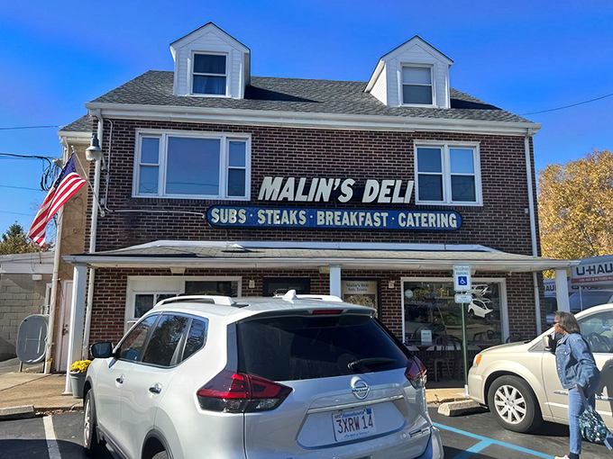 The unassuming brick facade of Malin's Deli stands like a time capsule of authentic American sandwich craftsmanship, proudly waving its flag over Newark's culinary landscape.