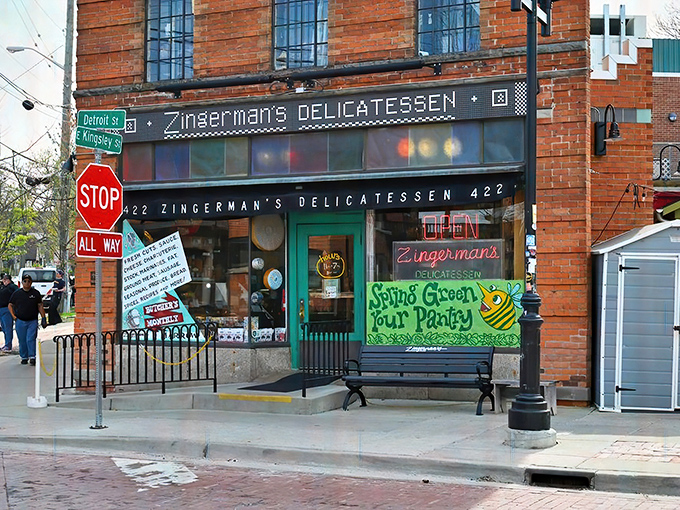 The iconic red brick exterior of Zingerman's stands like a beacon of sandwich salvation on the corner of Detroit and Kingsley Streets in Ann Arbor.