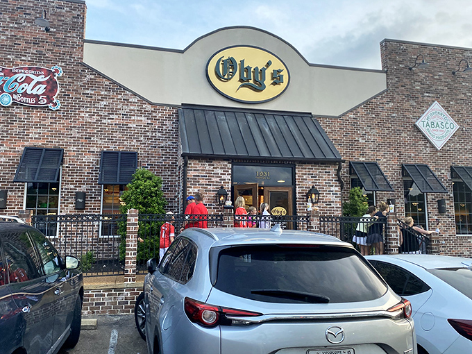 Oby's brick exterior welcomes hungry visitors with its iconic oval sign&mdash;like a beacon of sandwich salvation in Oxford's culinary landscape.