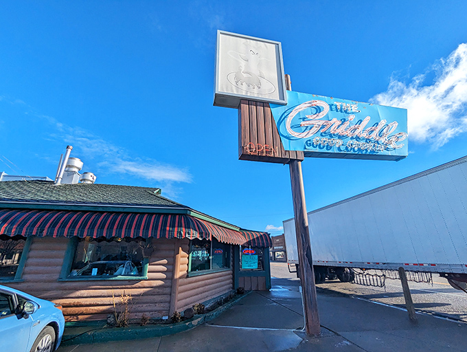 The iconic blue neon sign beckons hungry travelers like a desert oasis. This log cabin diner on Winnemucca's main drag promises comfort food salvation.